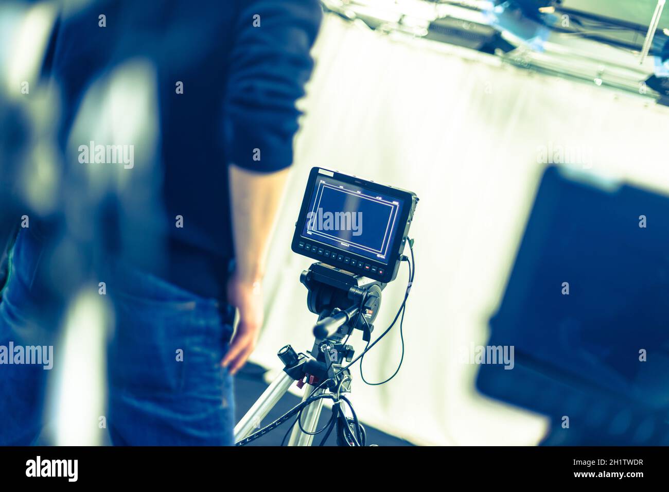 Male cameraman is operating a film camera in a television studio Stock ...