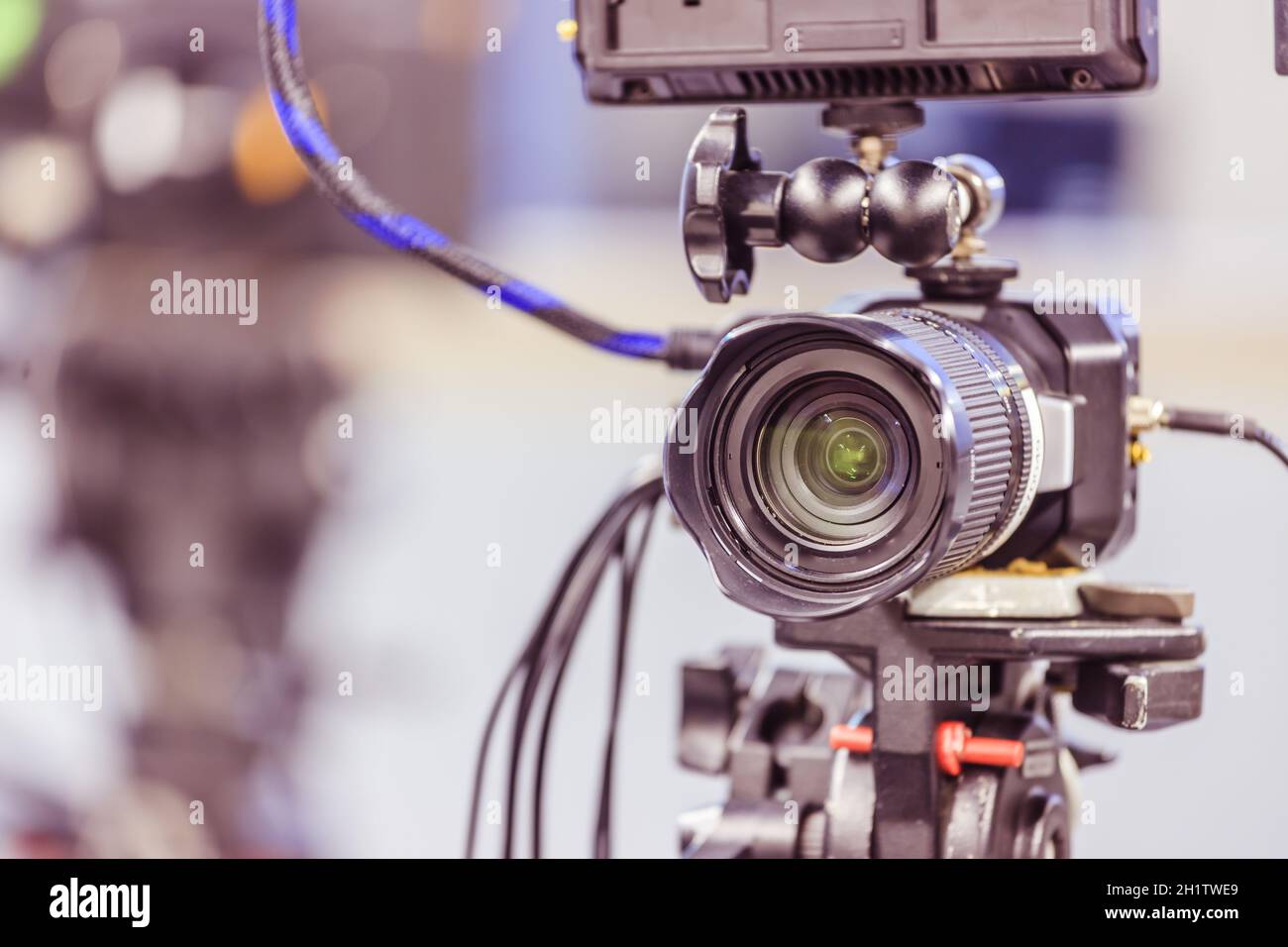 Film camera on a tripod in a television studio Stock Photo - Alamy