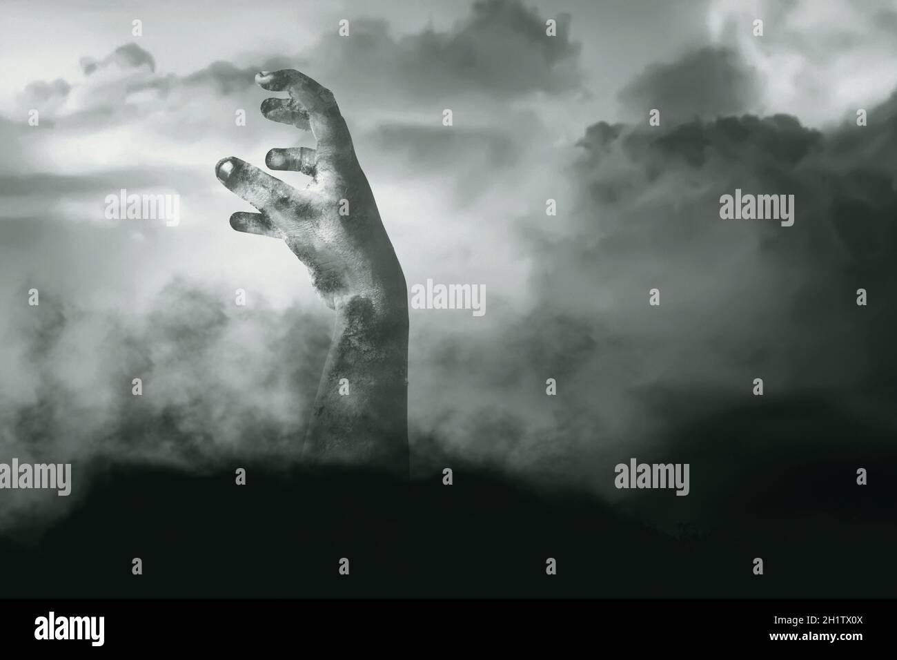 Zombie hand with blood and wound raised from the ground Stock Photo - Alamy
