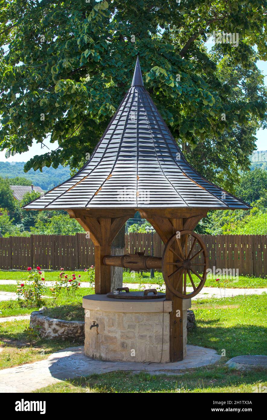 old beautiful well with sharp roof at the Park Stock Photo - Alamy