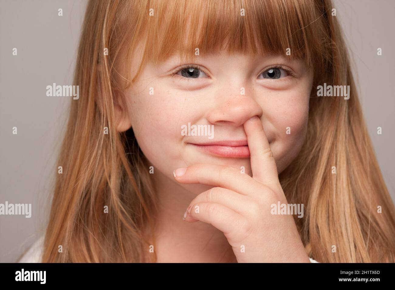 Portrait of an Adorable Red Haired Girl on a Grey Background Stock ...