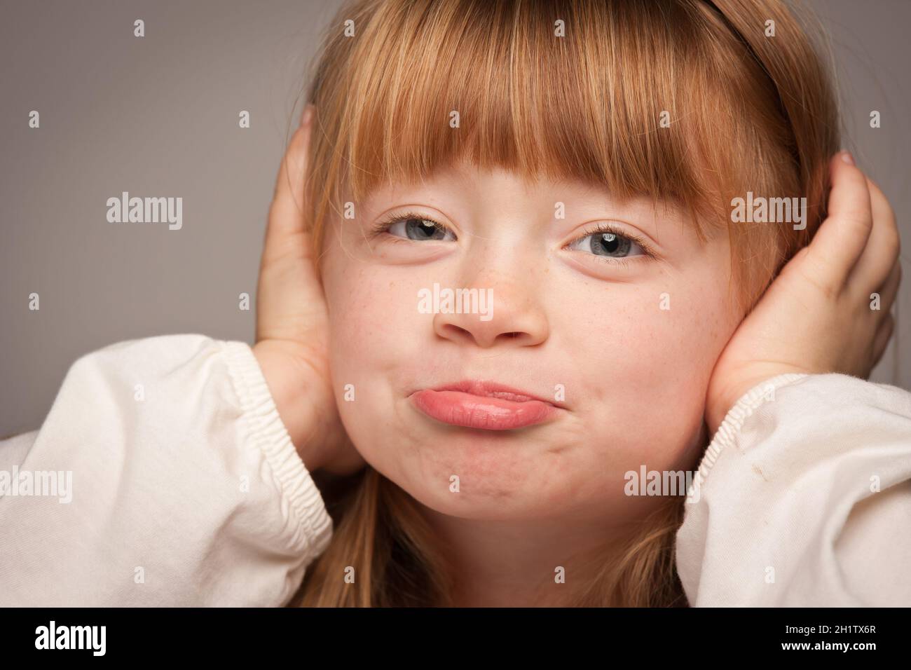 Fun Portrait of an Adorable Red Haired Girl on a Grey Background Stock ...