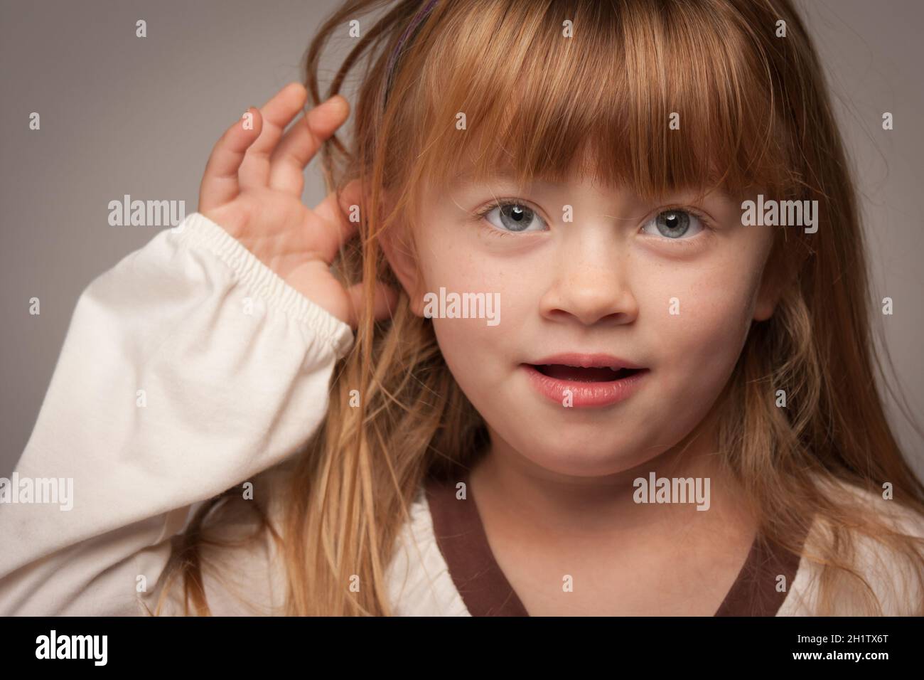Fun Portrait of an Adorable Red Haired Girl on a Grey Background Stock ...