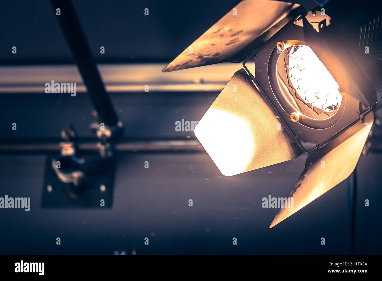 Professional orange studio spotlight hanging on the ceiling Stock Photo ...