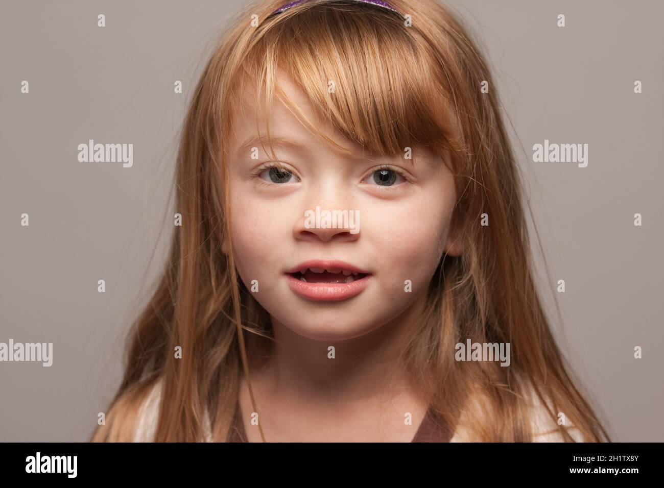 Portrait of an Adorable Red Haired Girl on a Grey Background Stock ...