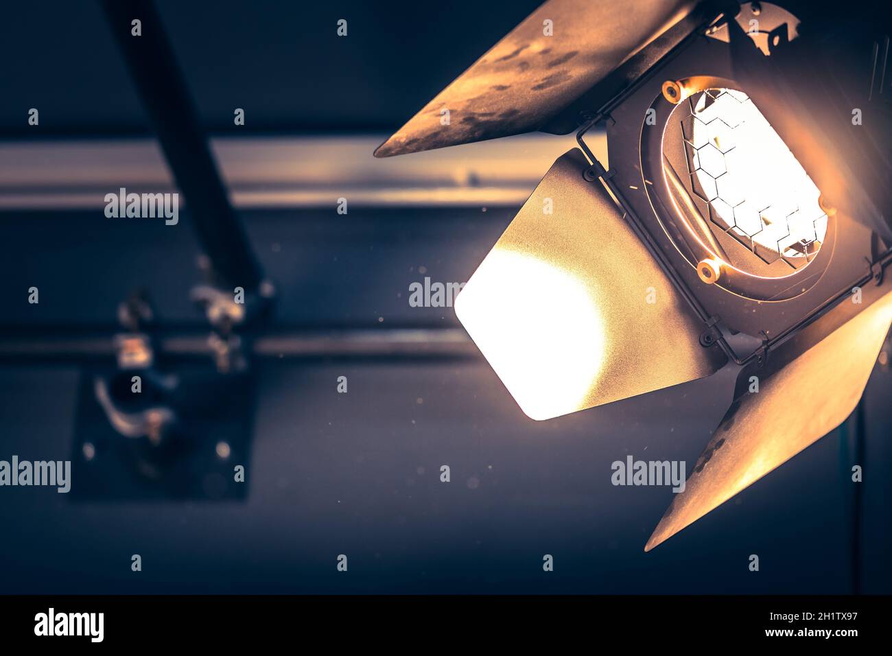 Professional orange studio spotlight hanging on the ceiling Stock Photo ...