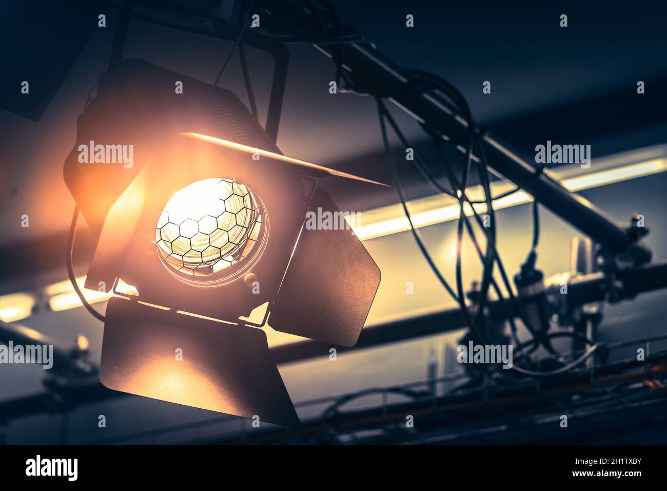 Professional orange studio spotlight hanging on the ceiling Stock Photo ...