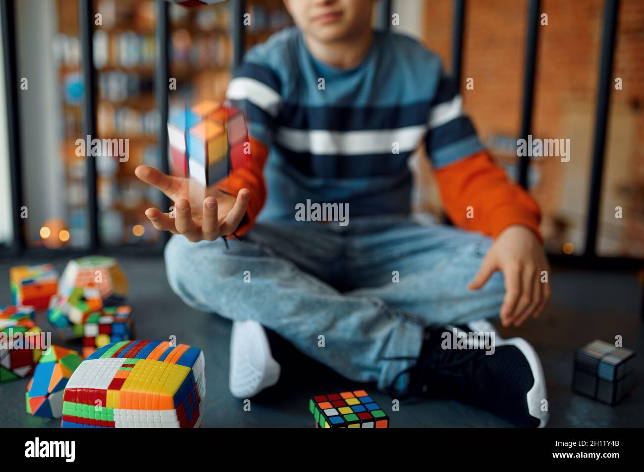 Male child play with puzzle cubes. Toy for brain and logical mind ...