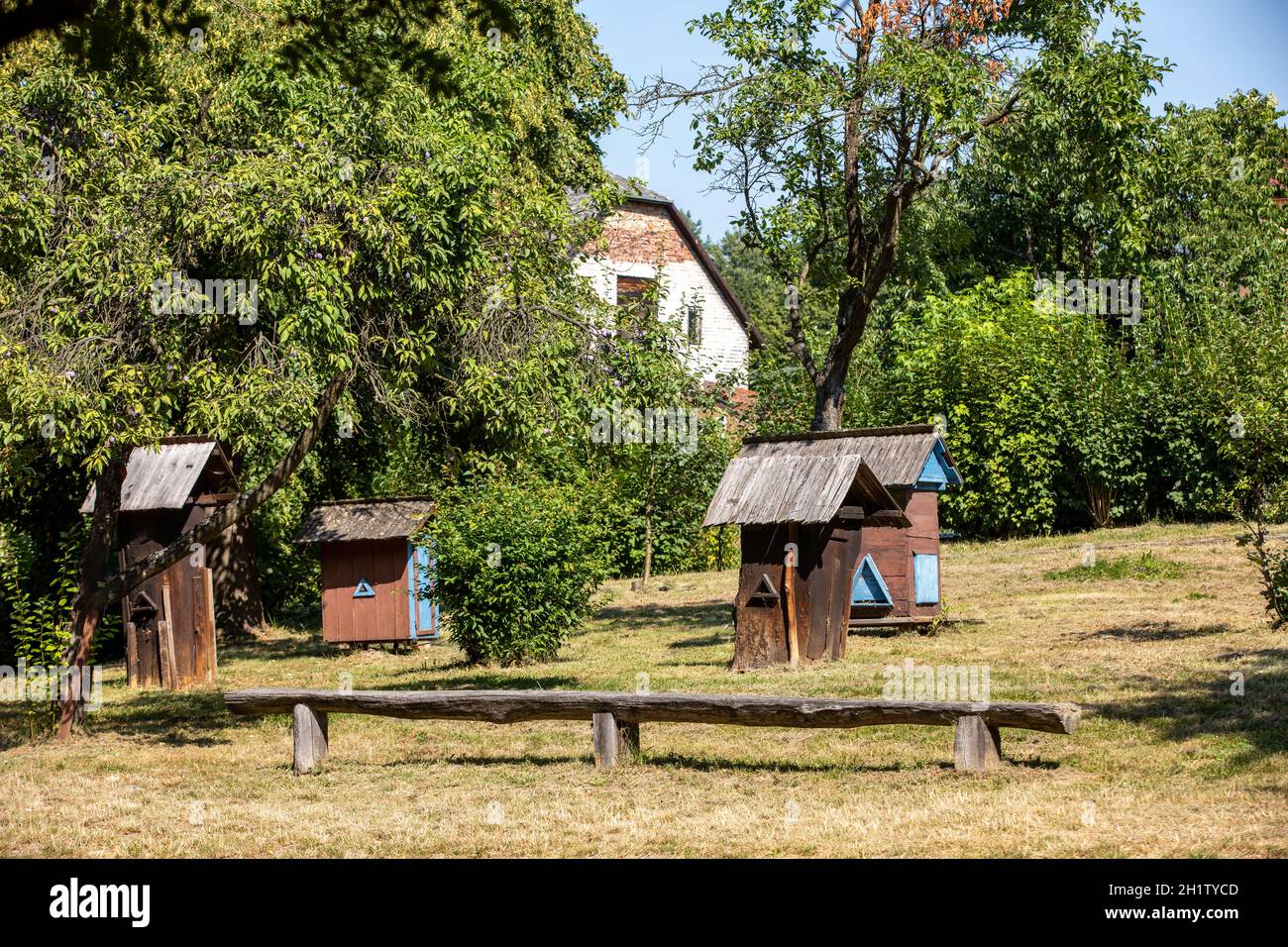 An apiary with old wooden hives in a rural garden Stock Photo - Alamy