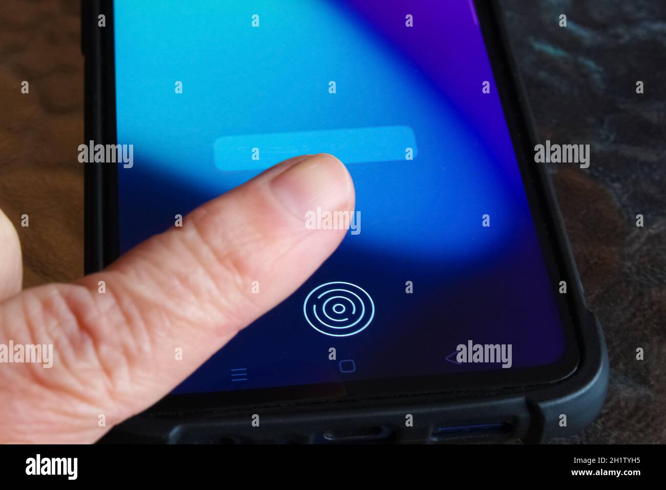 Hand holding modern mobile phone showing application with process of ...