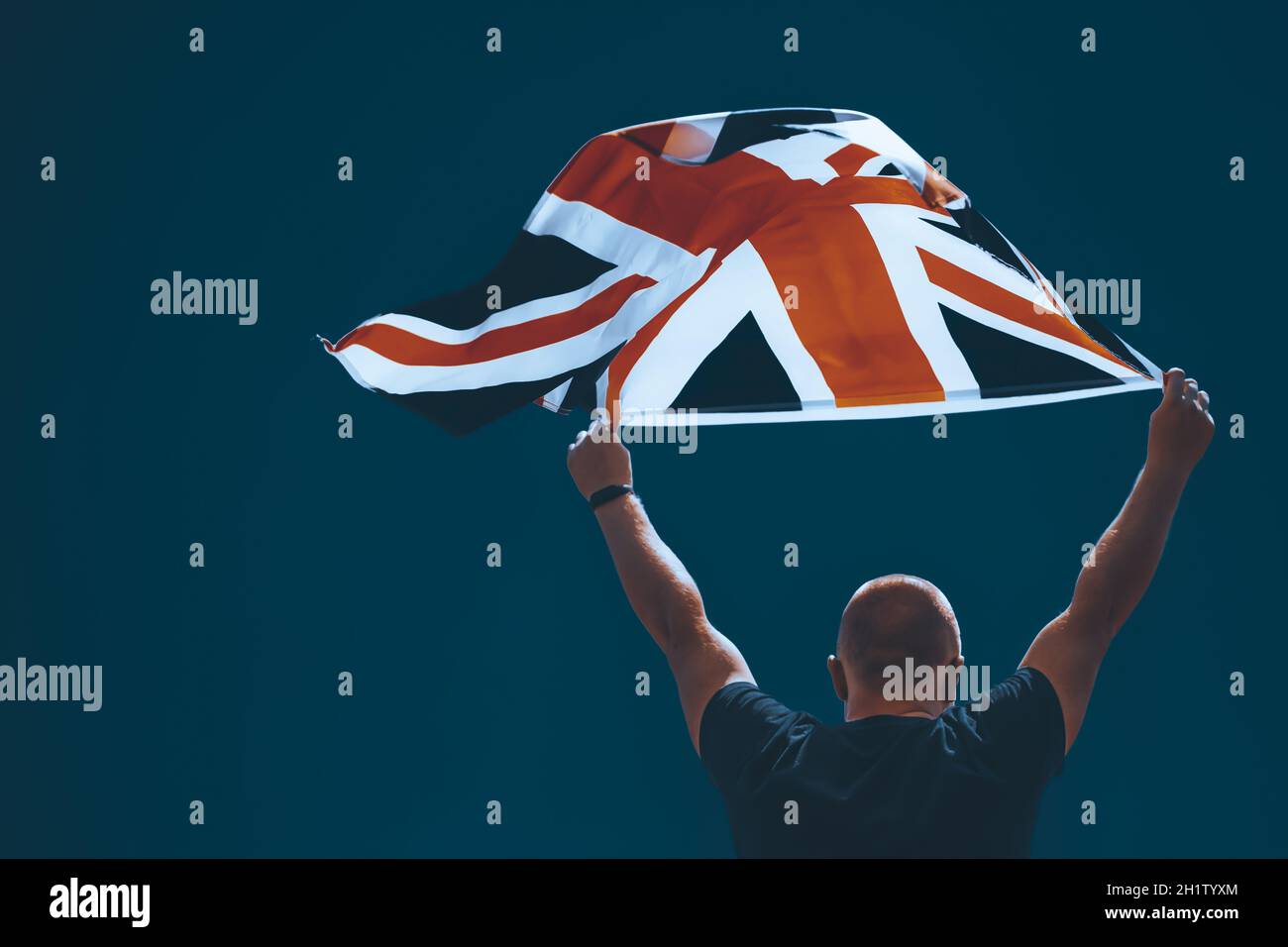 Man holding flag of UK. Patriot and supporter of Great Britain Stock ...
