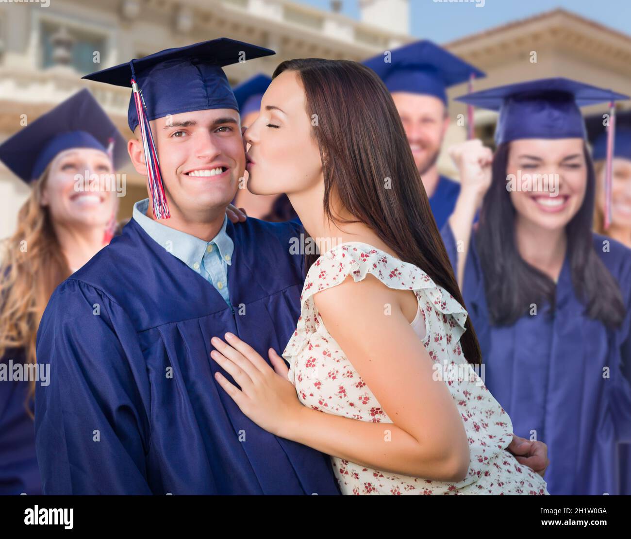 Female graduate kissing degree hi-res stock photography and images - Alamy