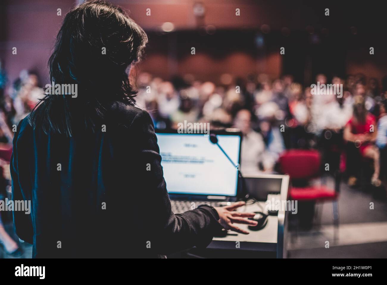 Female giving speech podium hi-res stock photography and images - Alamy