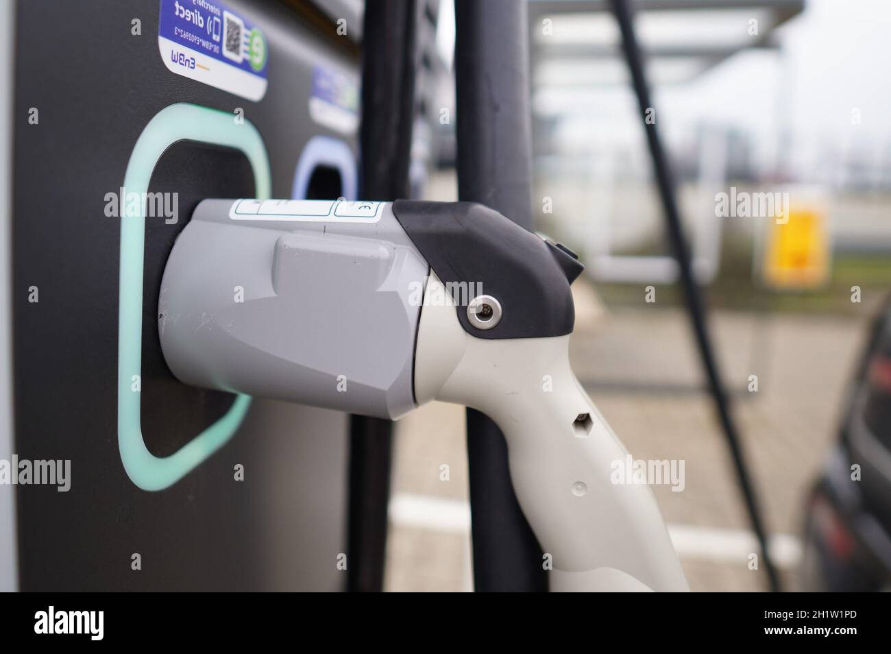 Electric car charging Stock Photo - Alamy