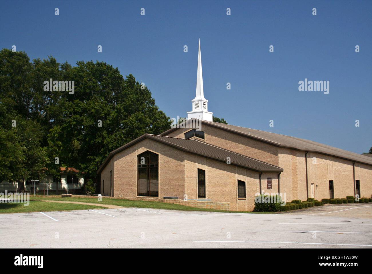 Small Rural Church With Blue Sky with Trees Stock Photo - Alamy
