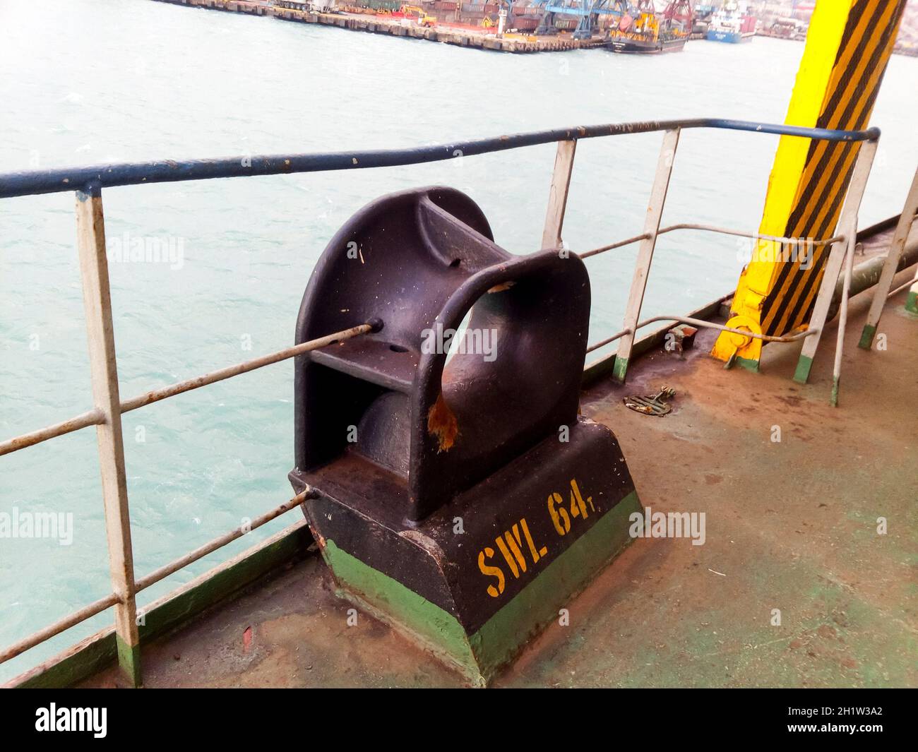 Mooring bollard on the decks of an industrial seaport Stock Photo - Alamy