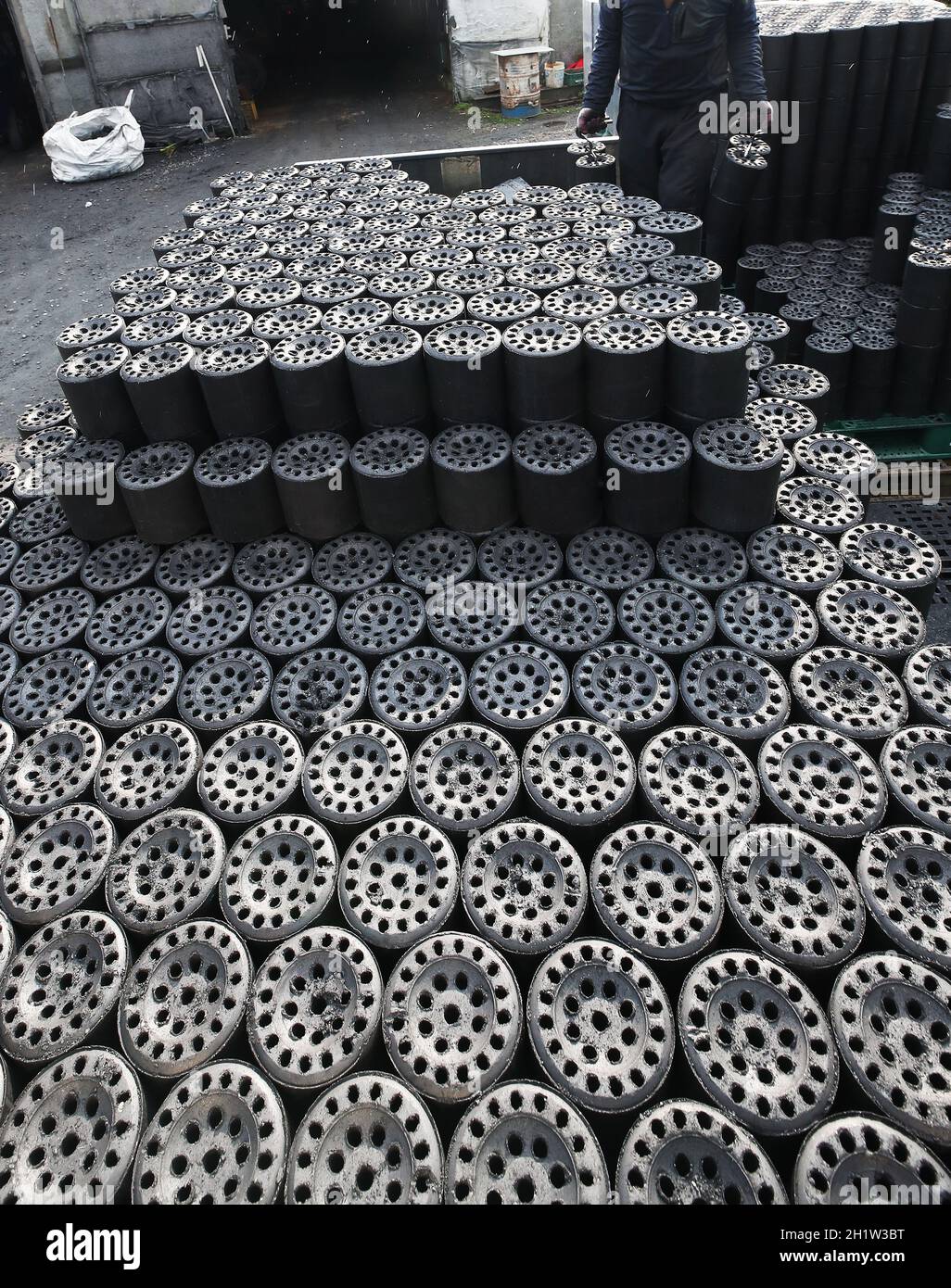 19th Oct, 2021. Shipping coal briquettes A worker loads coal briquettes ...