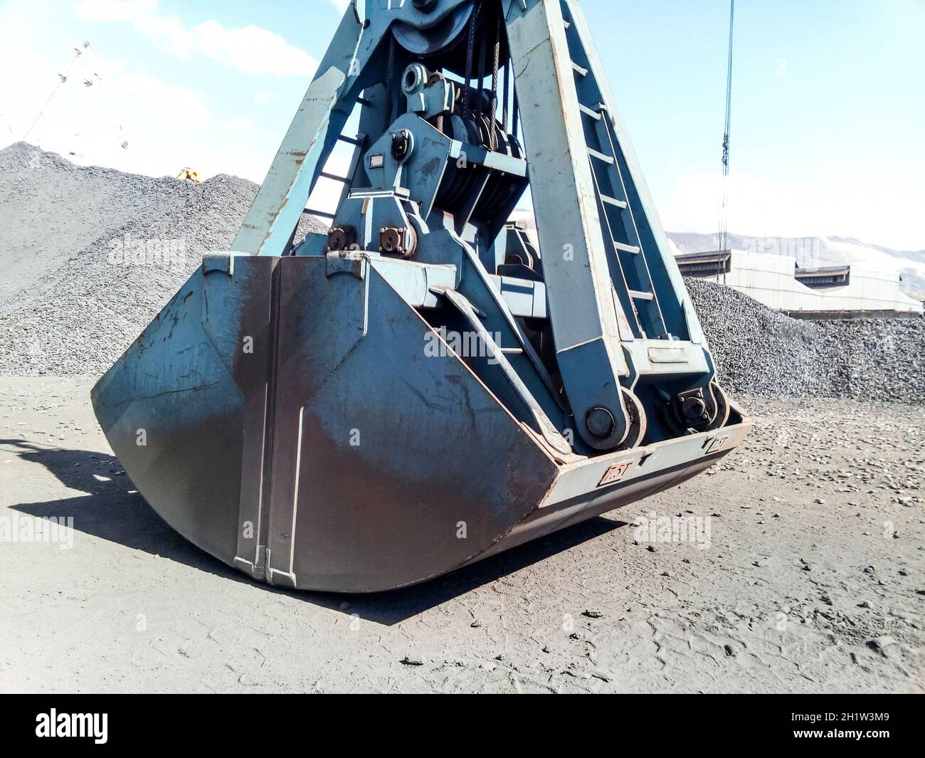 Clamshell bucket in the cargo port. Bucket for loading coal Stock Photo ...
