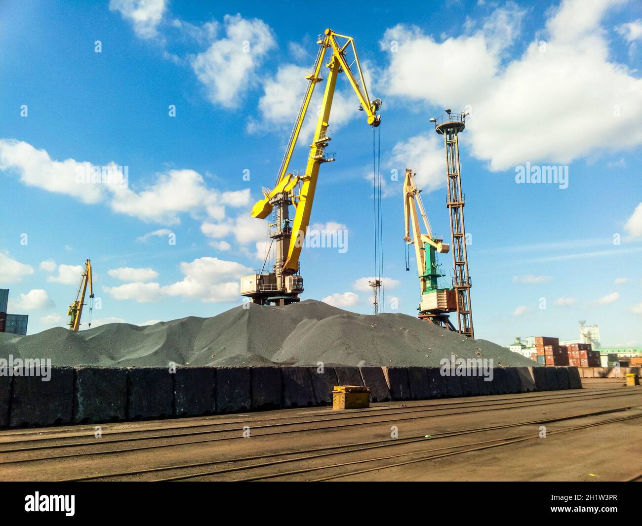 Cargo industrial port, port cranes. Loading of anthracite ...
