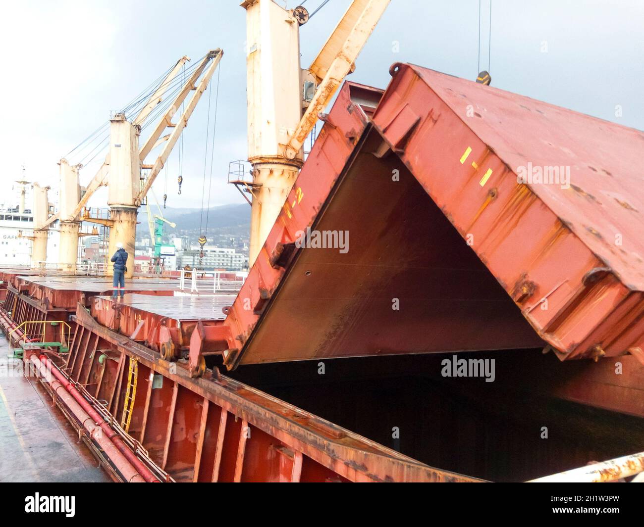 Folded steel roof of the hold on the ship Stock Photo - Alamy