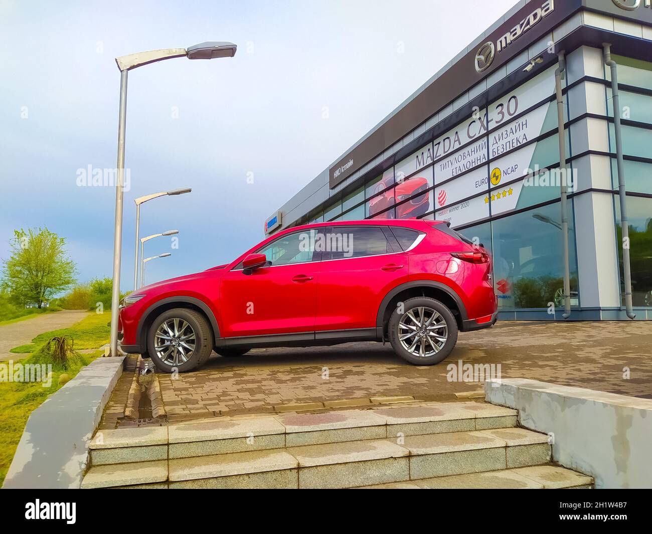 Kyiv, Ukraine - August 15, 2020: retail of Mazda logo on store front ...