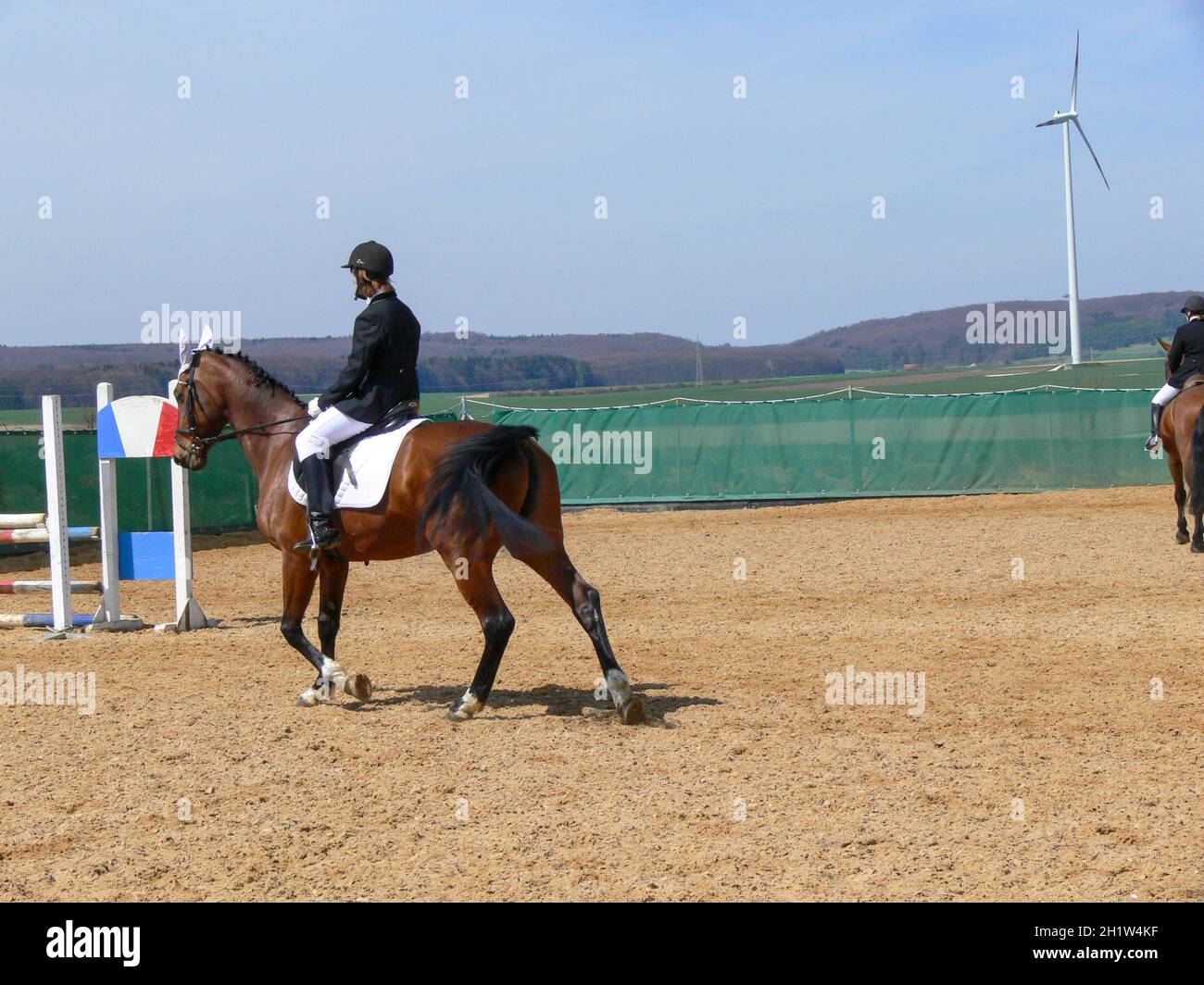 Rider on a show jumping tournament Stock Photo - Alamy