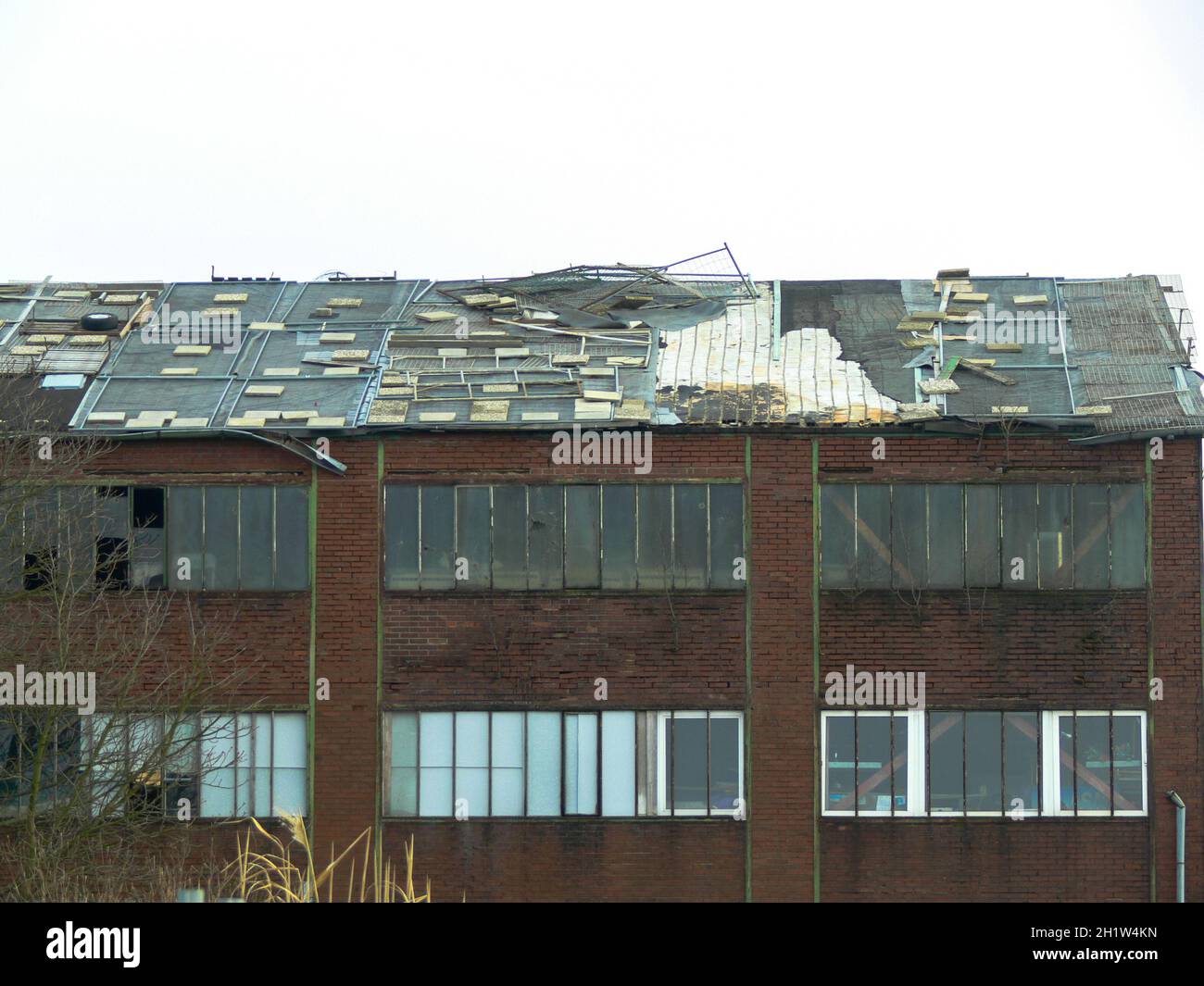 Old abandoned building with broken roof and windows Stock Photo - Alamy