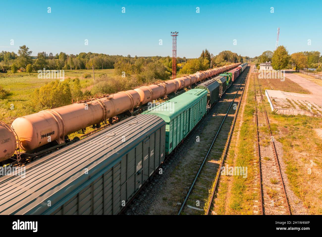Wagons of a cargo train in motion. Scenic view of mixed freight train ...