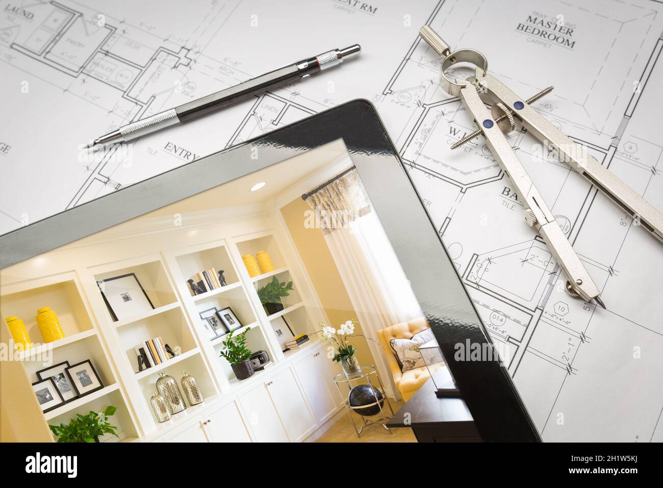 Computer Tablet with Finished Built-in Shelves and Cabinets Over House ...