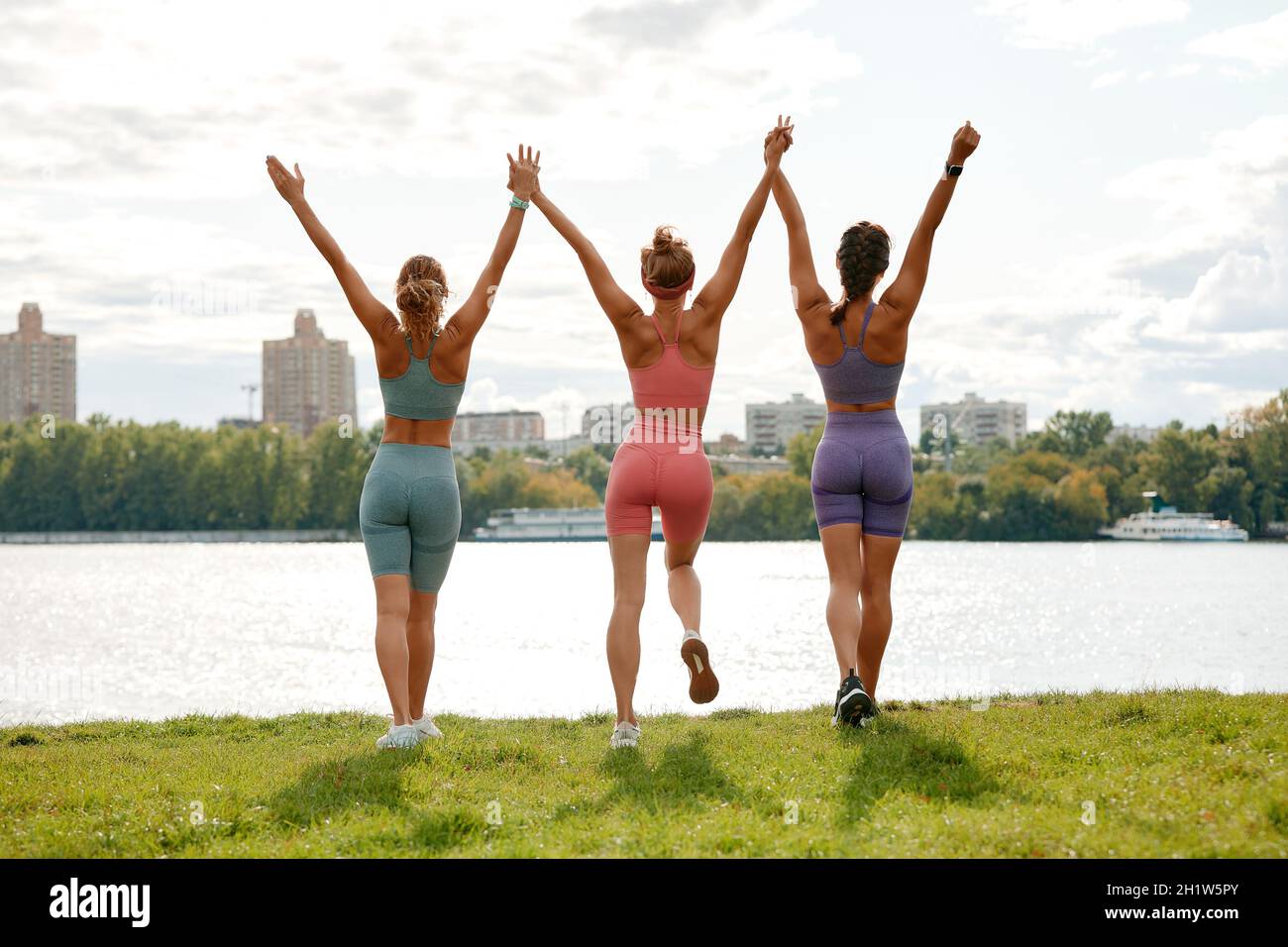 Group of diverse fit and active athletic female friends smiling and ...