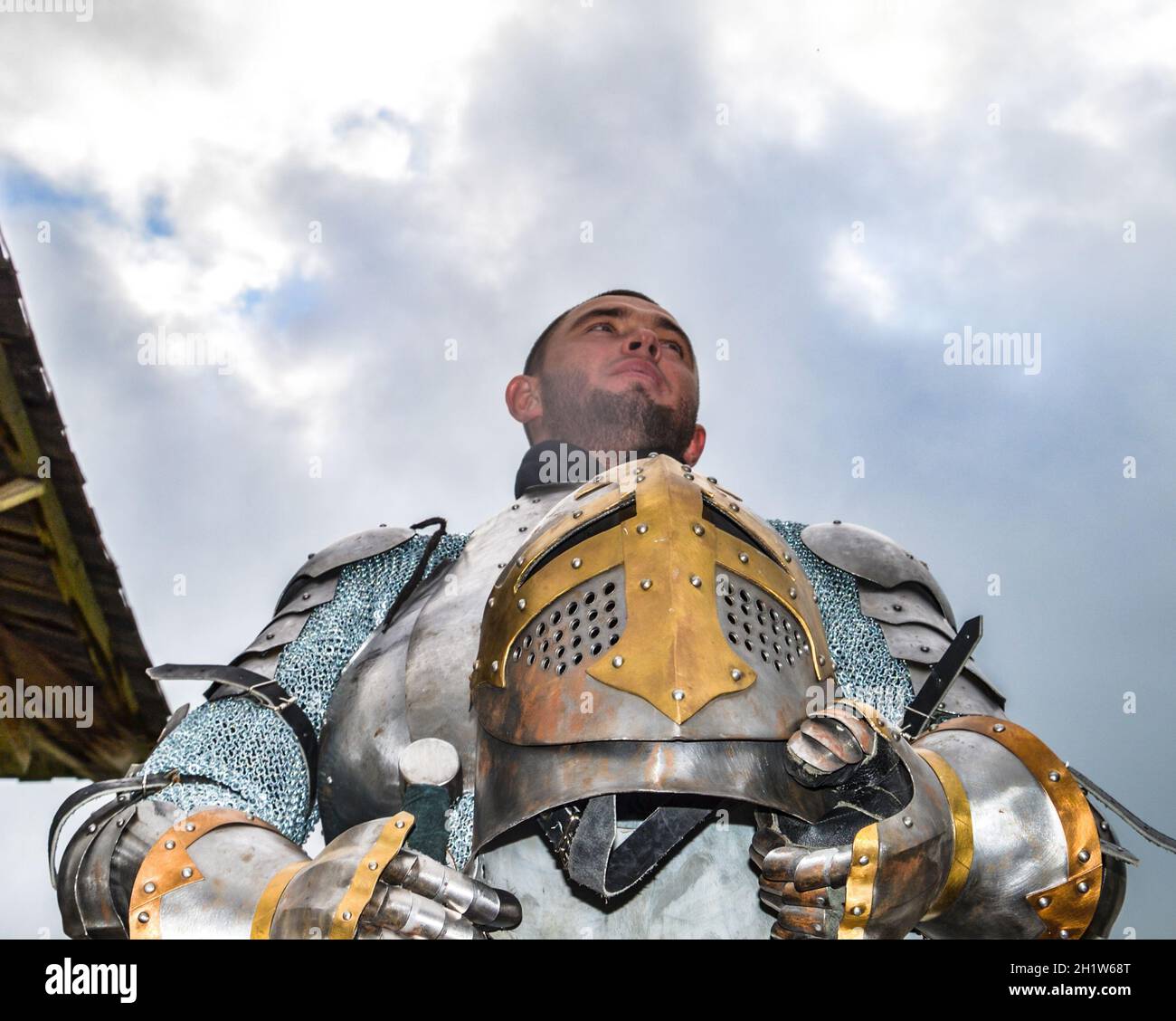 Knight in armor on the background of a cloudy sky. Knightly armor and ...