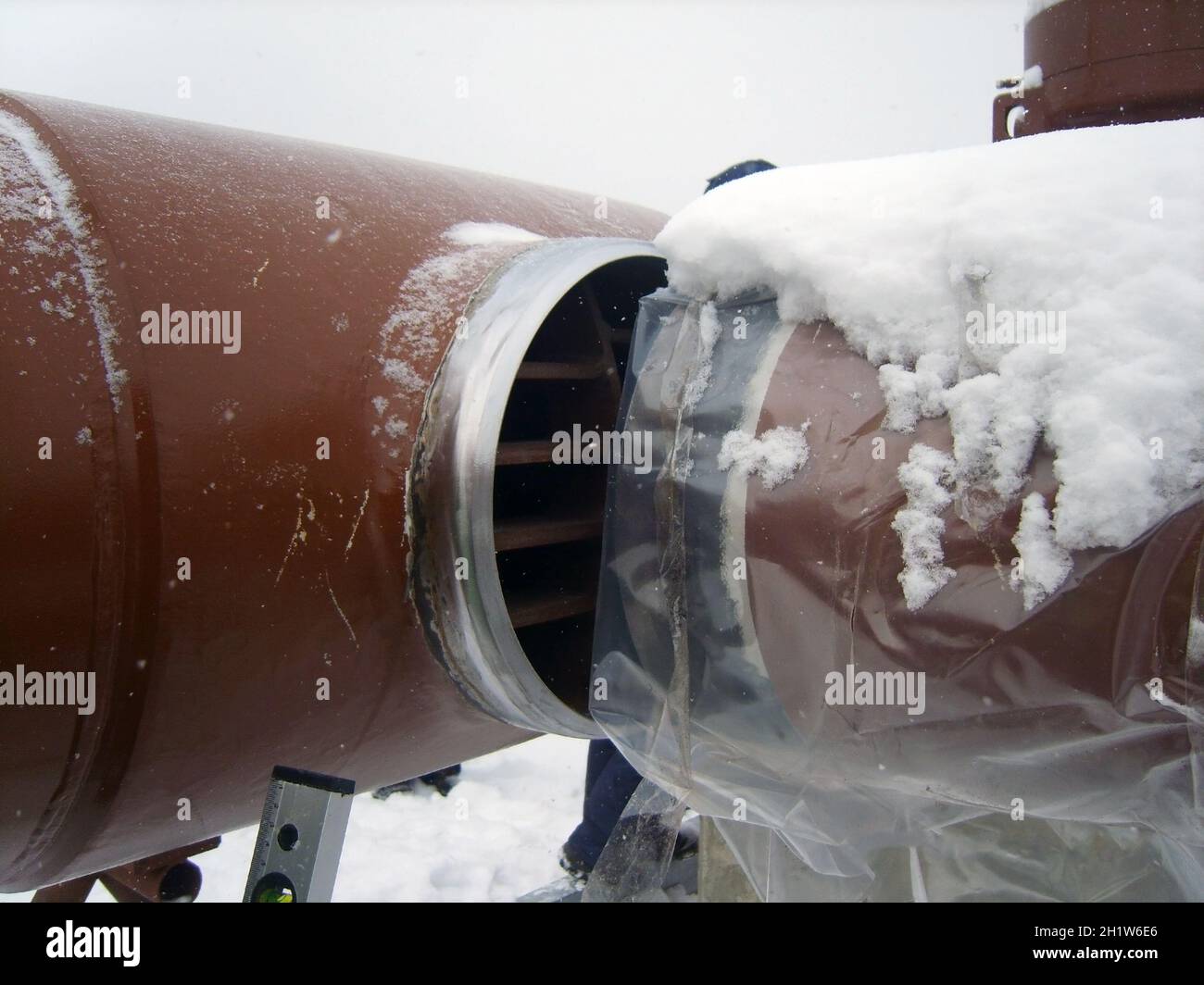 Tee. Place of future connection of two pipelines. Installation works ...