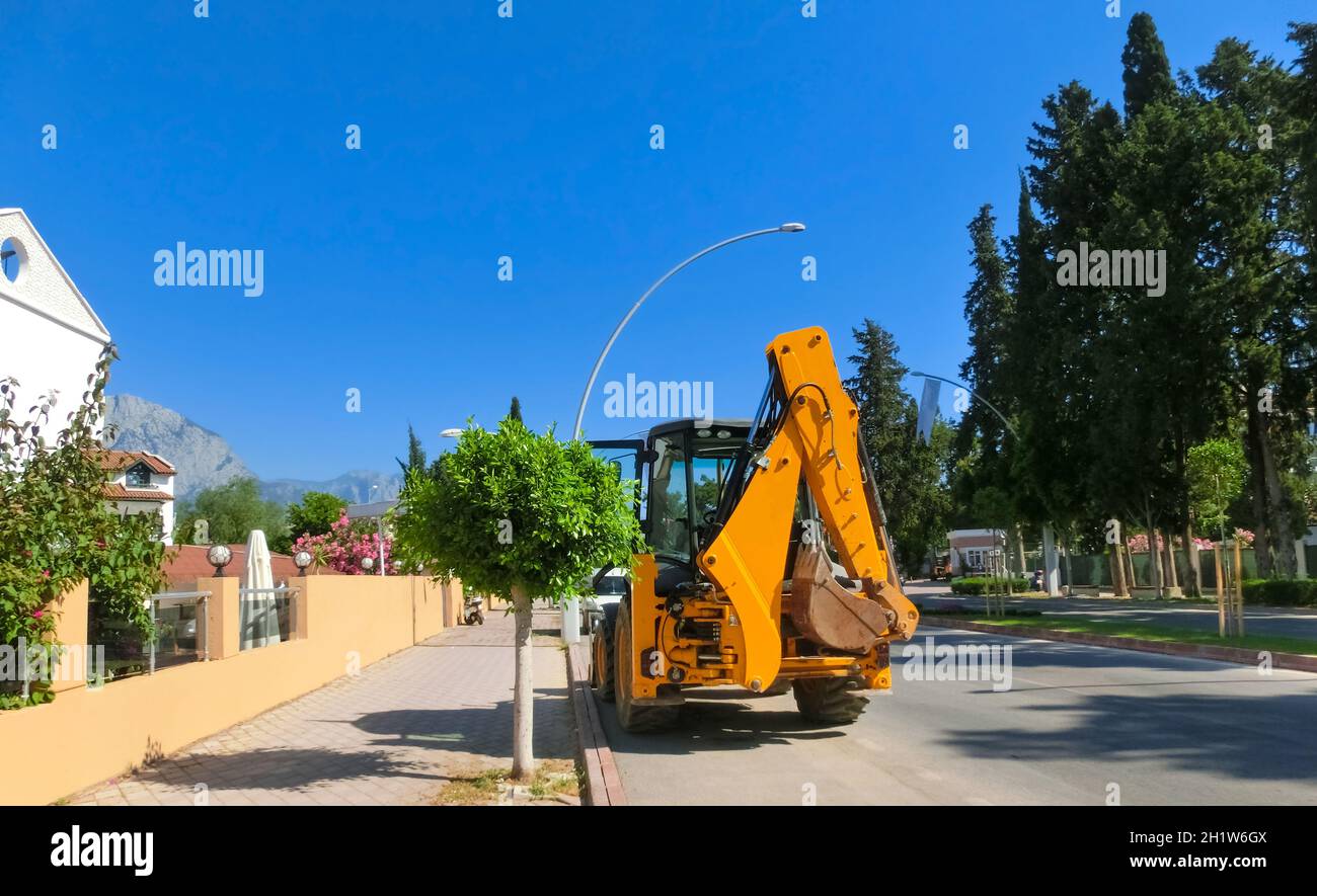 Mini bulldozer or excavation or loader on road. Construction, industry ...