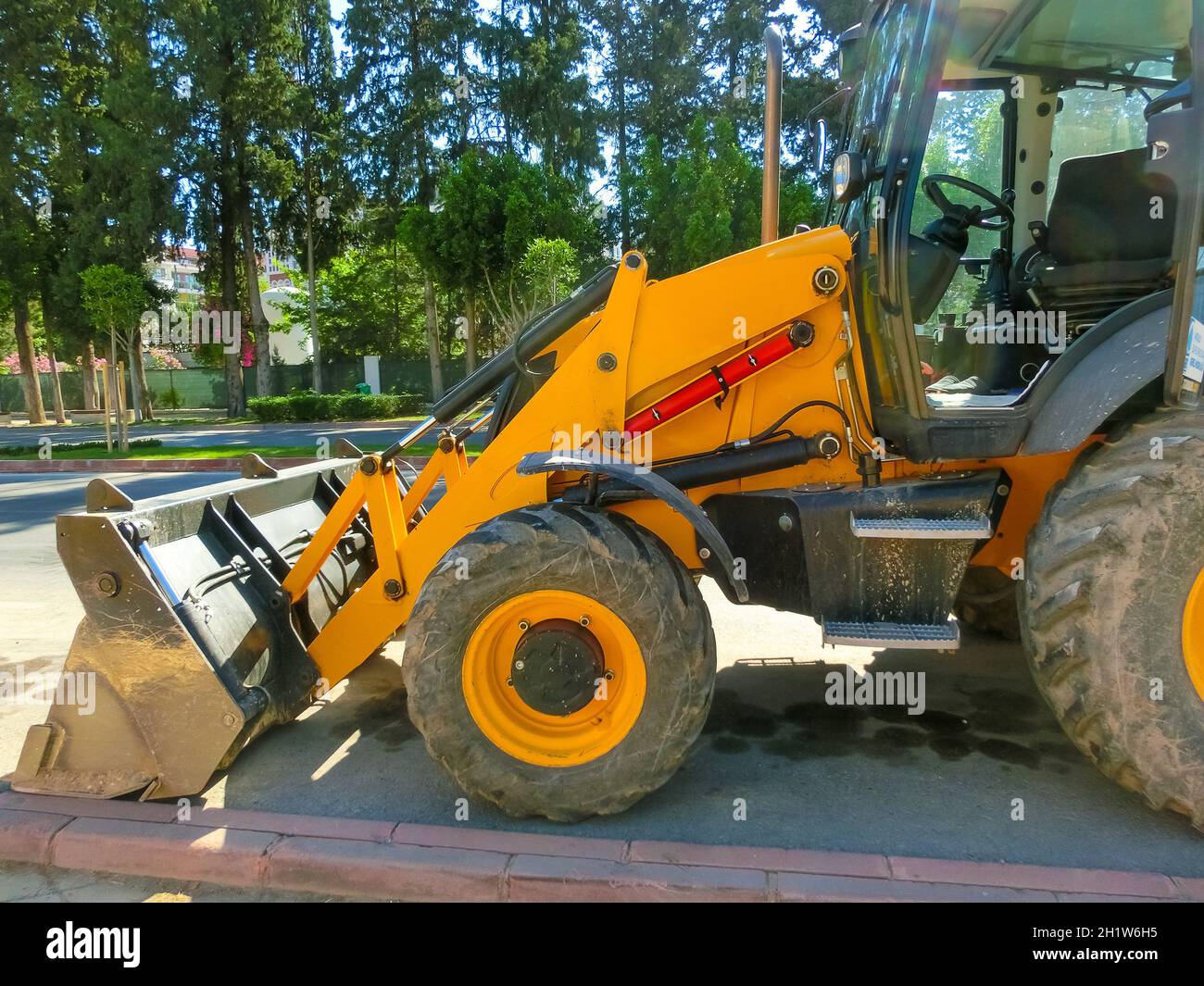 Mini bulldozer or excavation or loader on road. Construction, industry ...