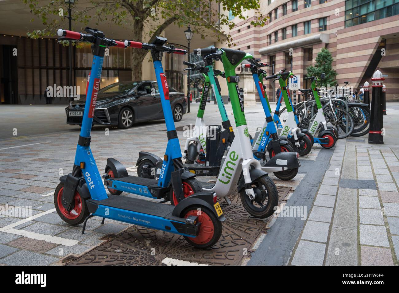 Lime and Dott rental trial electric scooters parked in Bucklersbury. City of London, England, UK ...