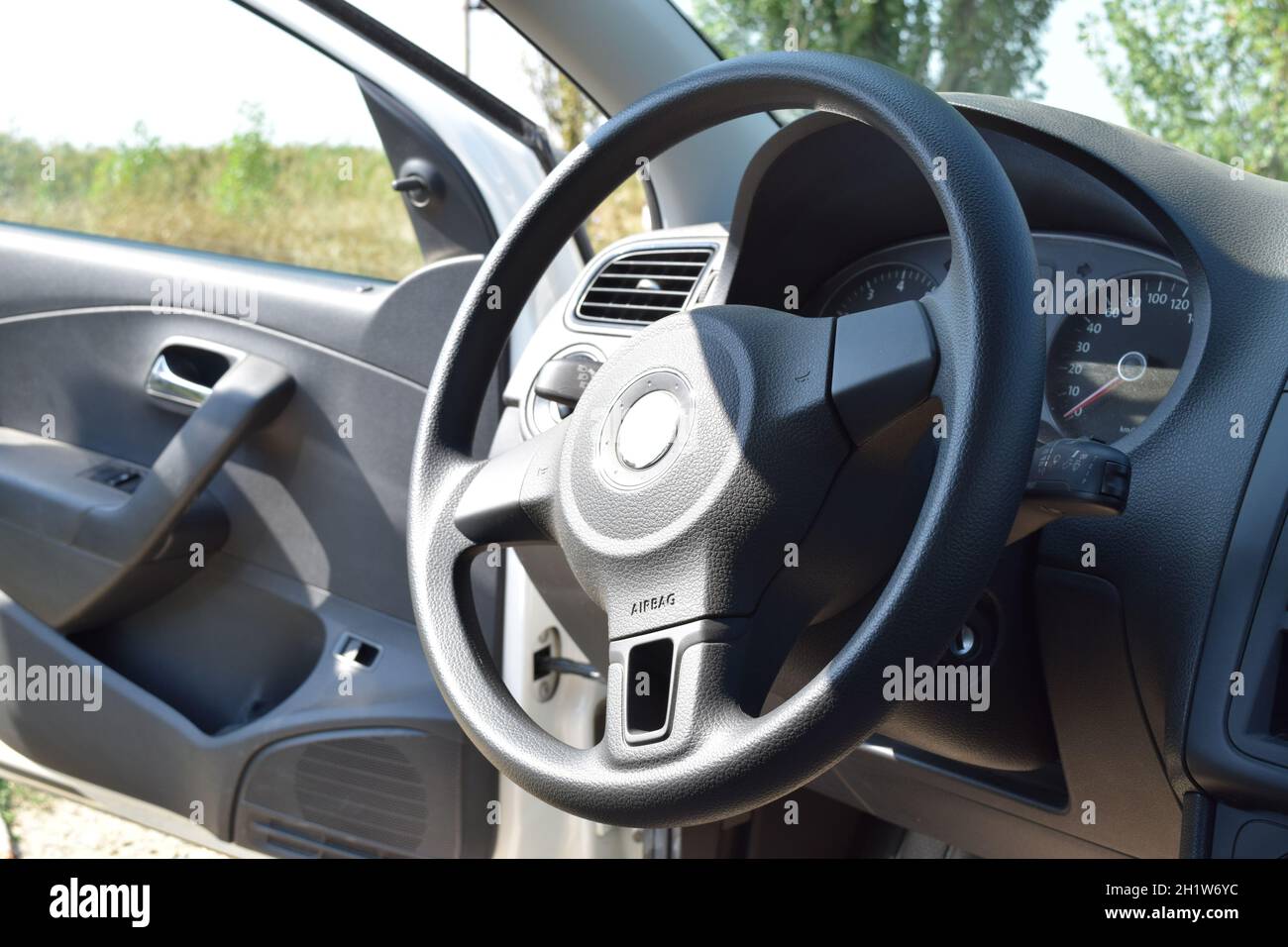 Salon of the car with an open door. Car interior Stock Photo - Alamy