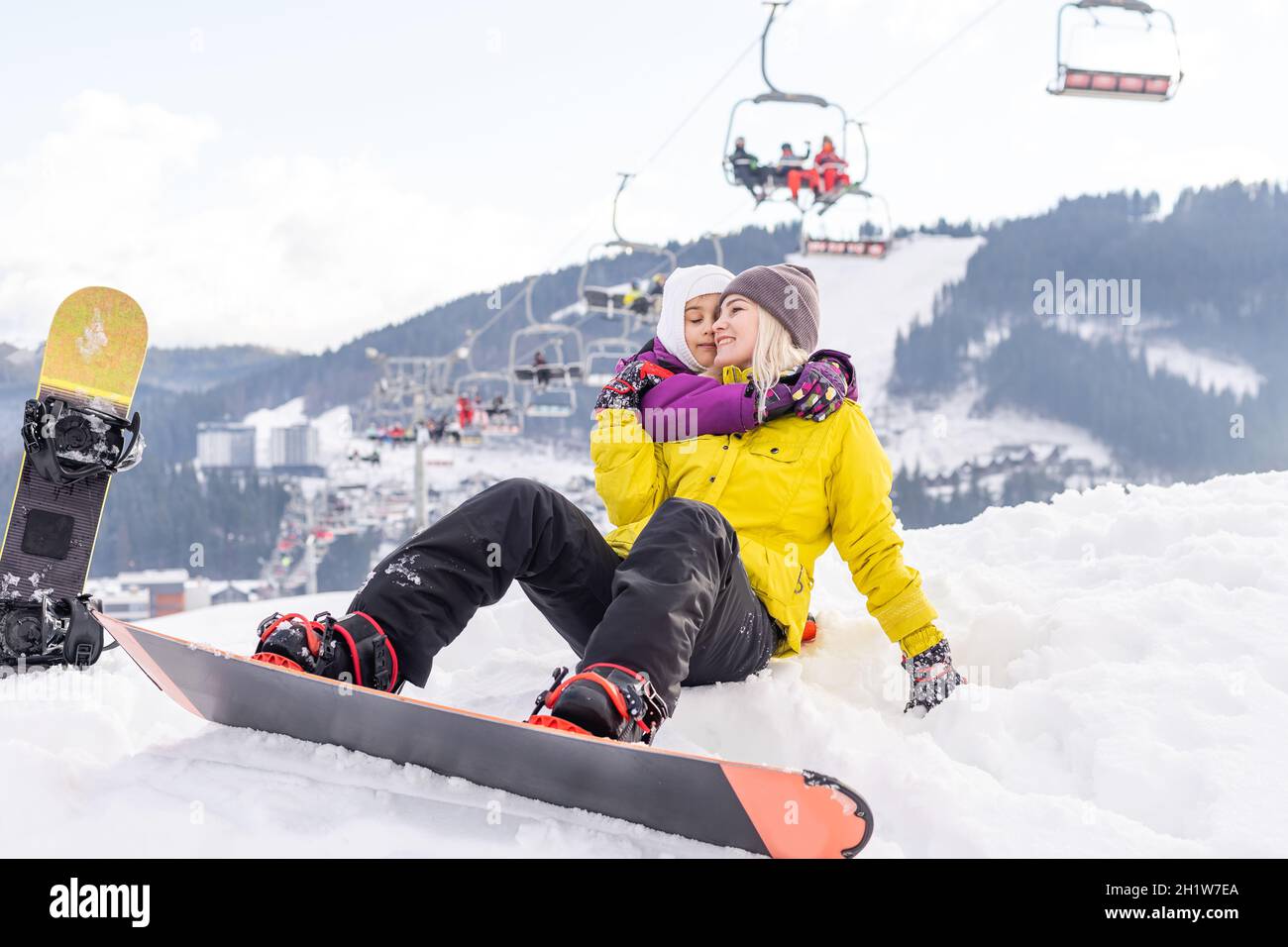Family winter vacation in ski resort Stock Photo - Alamy