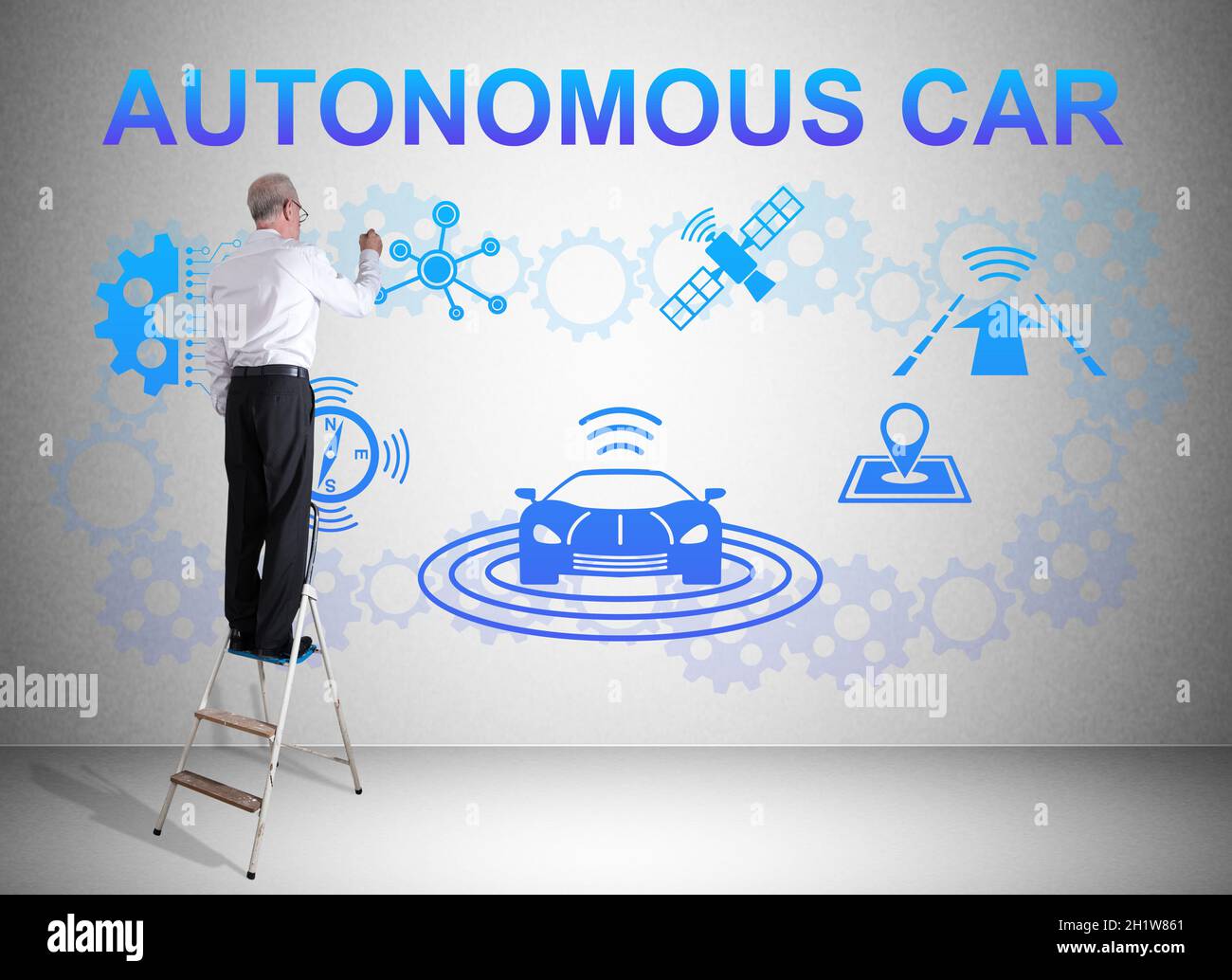 Man on a ladder drawing autonomous car concept on a wall Stock Photo ...
