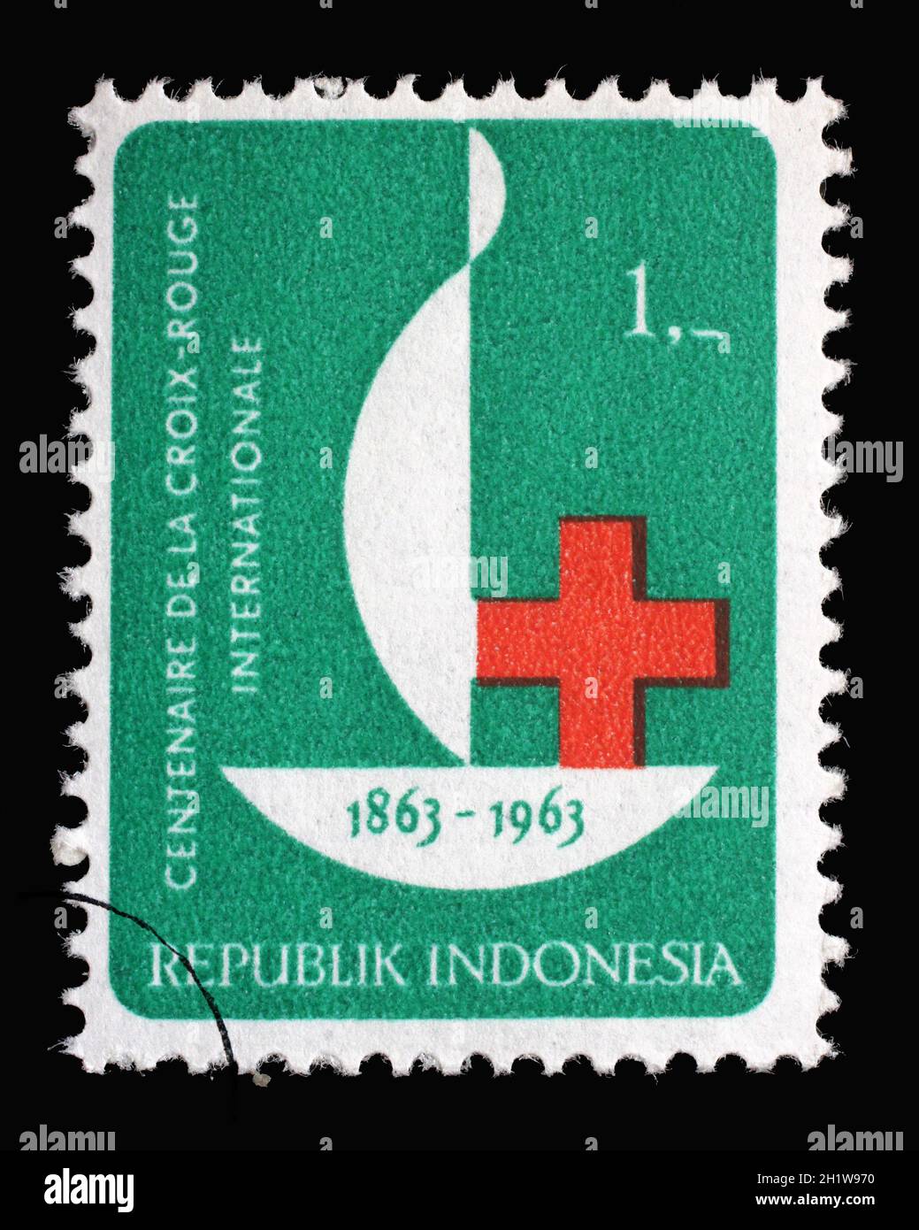 Stamp printed in Indonesia shows 100 years of the International Red ...