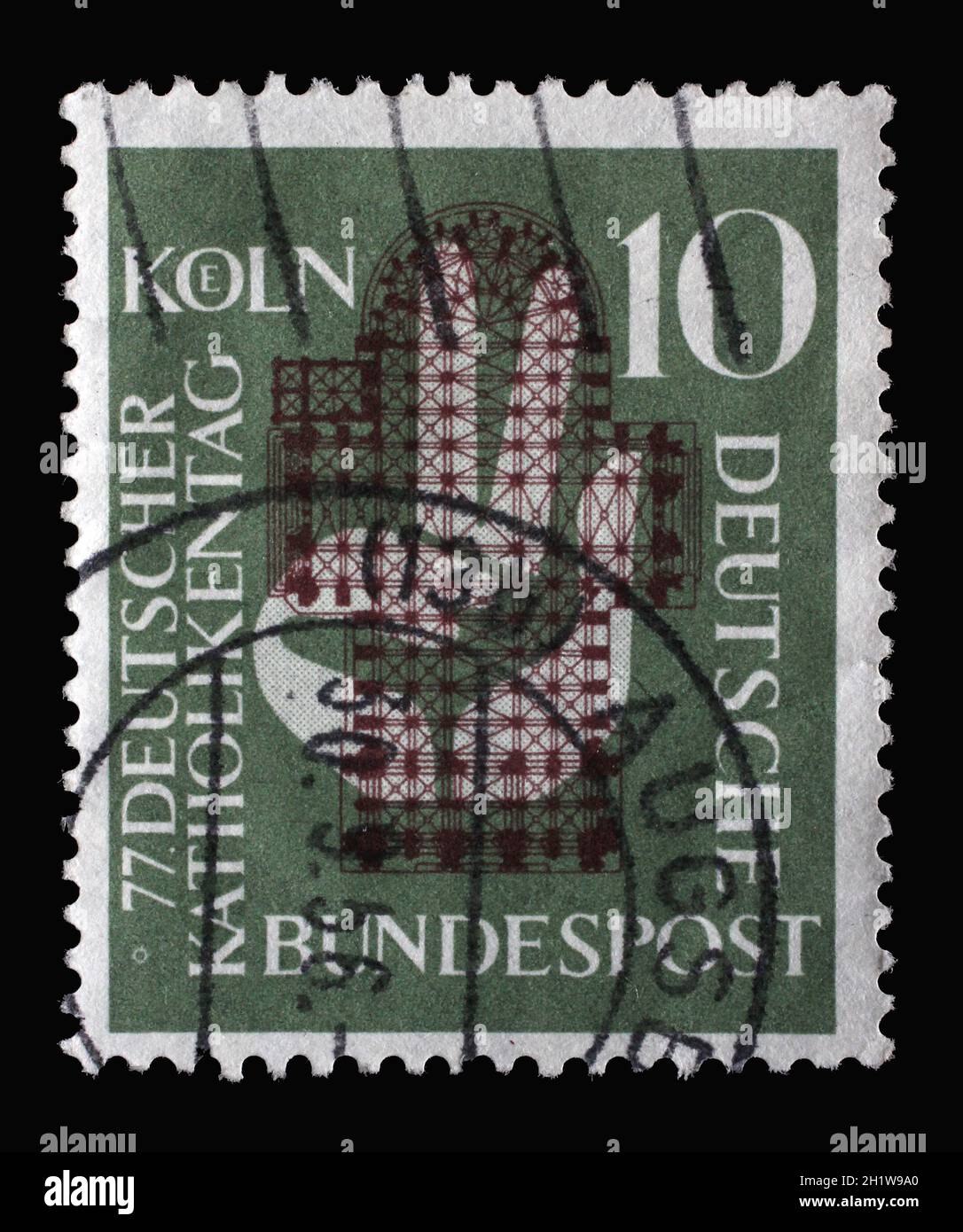 Stamp printed in Germany, shows a hand raised to the oath in front of ...