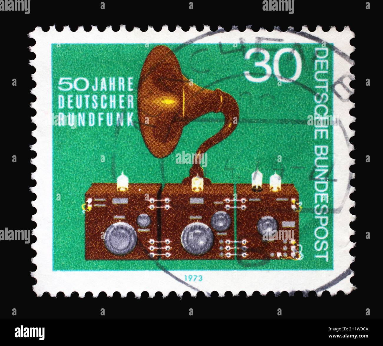 A stamp printed in Germany showing an old radio, 50th Anniversary of ...