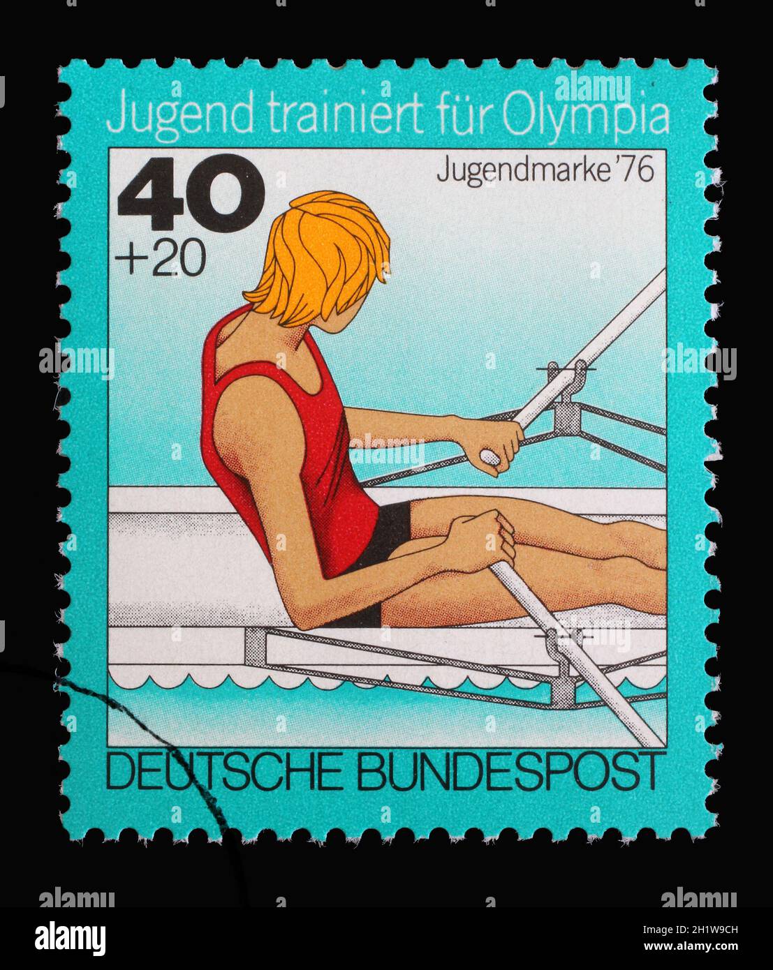A stamp printed in Germany shows Rowing, single sculls, Youth training ...