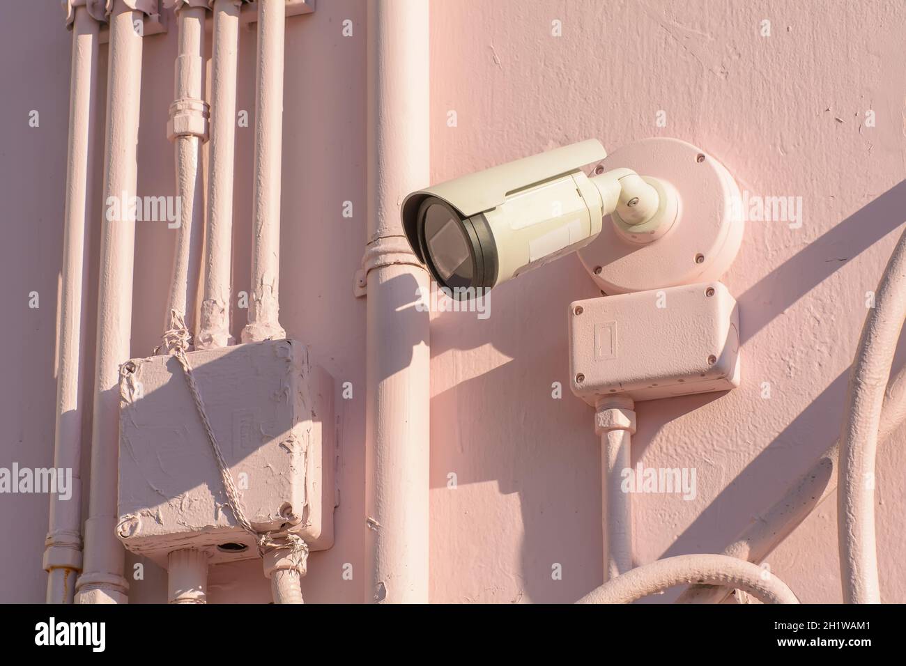 CCTV camera mounted on a stone wall Stock Photo - Alamy