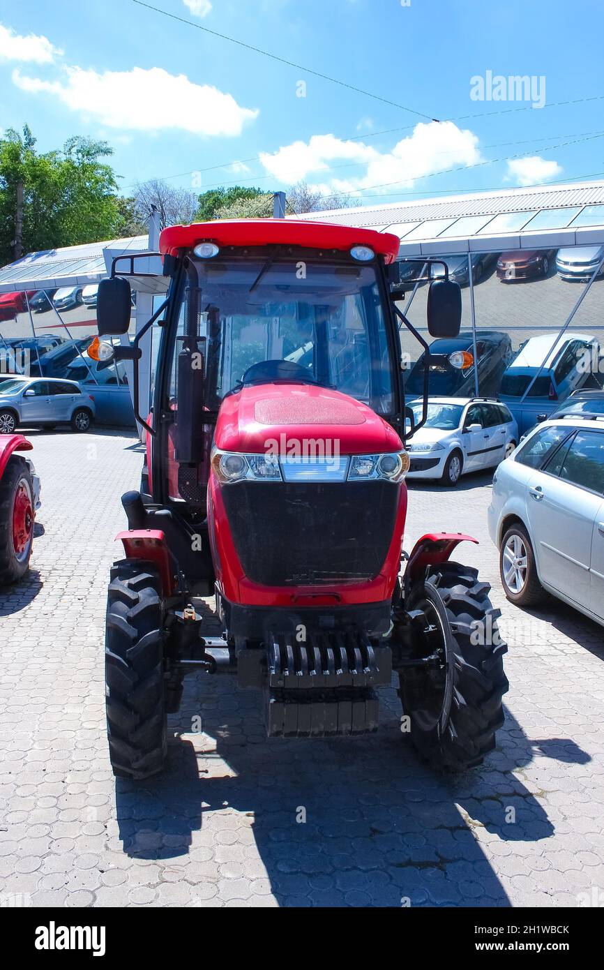 The colorful red tractors. The agriculture, farming concept Stock Photo ...