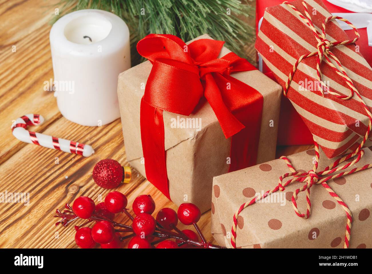 wrapped christmas gift boxes with ribbons on table Stock Photo - Alamy