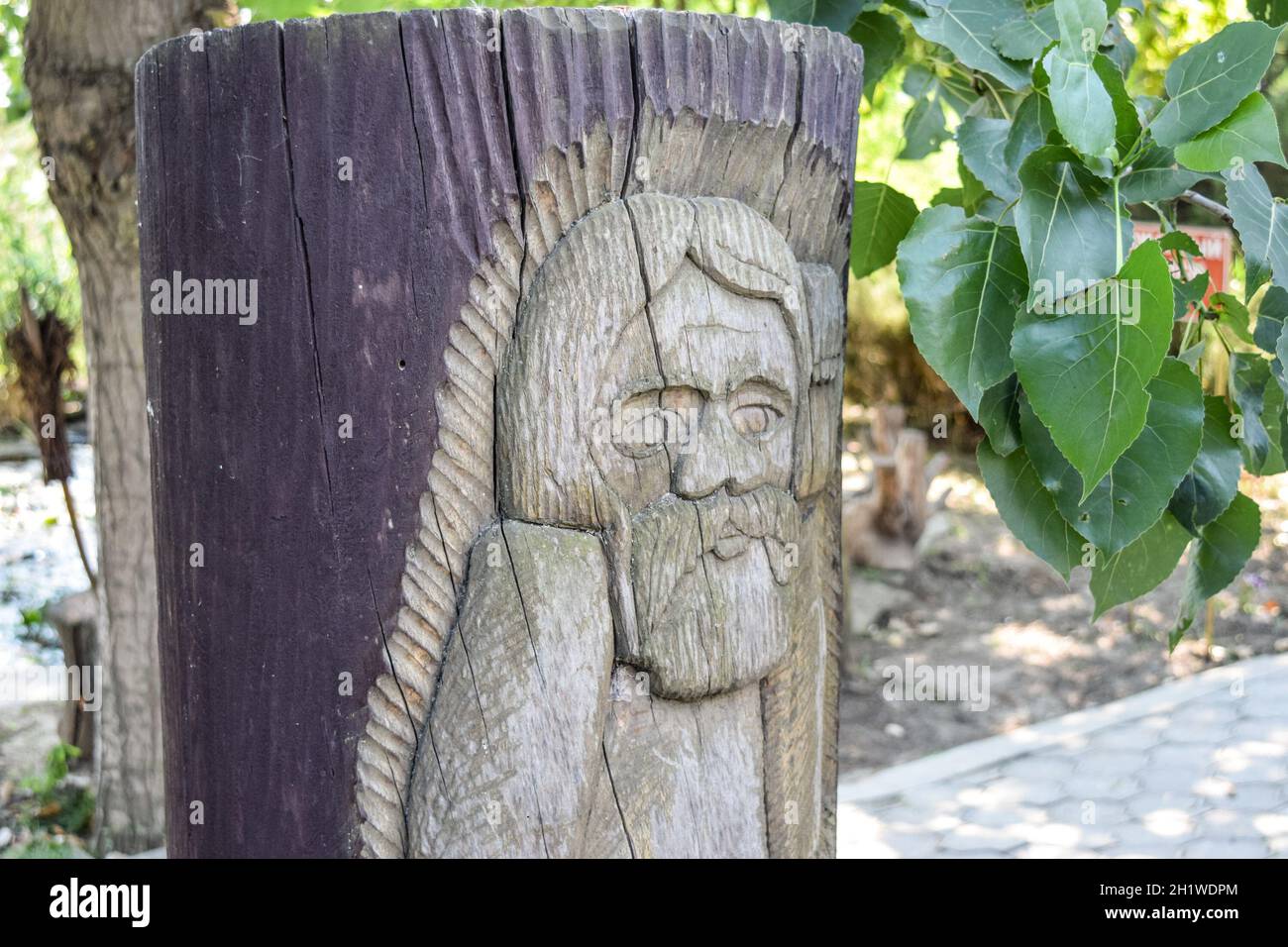Wooden idol. Woodcarving. Decoration of the park in the form of statues ...