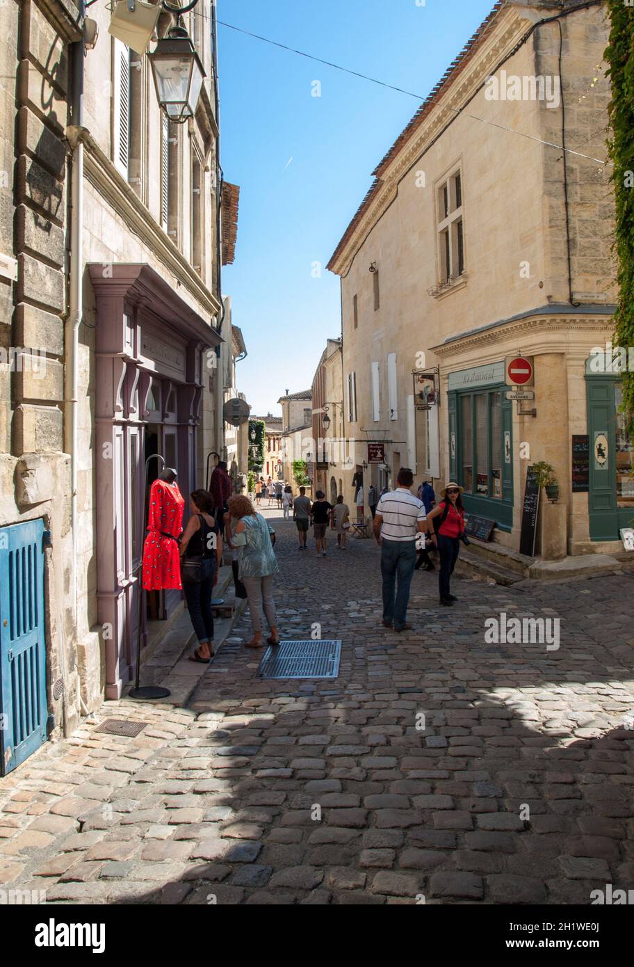 St Emilion, France - September 8, 2018: Tourists in the cobbled streets ...