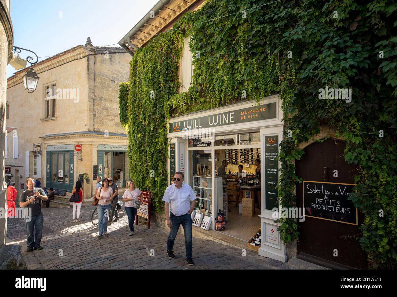 St Emilion, France - September 8, 2018: Tourists in the cobbled streets ...