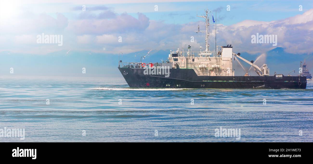 The small ship at blue sea near the coast Stock Photo - Alamy