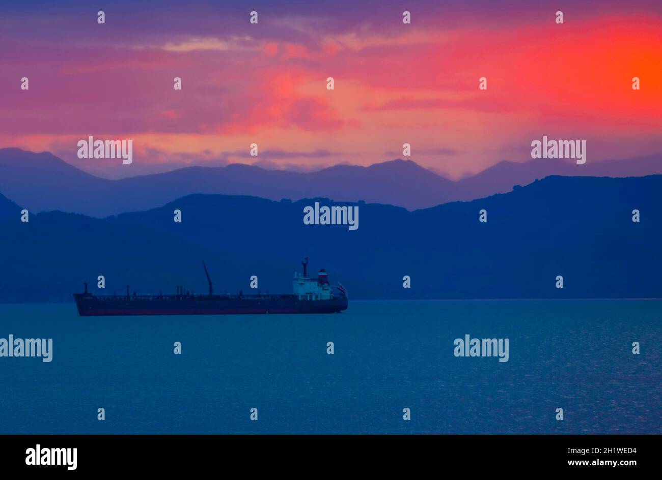 The transport ship at sunset in the Avacha Bay on the Kamchatka ...